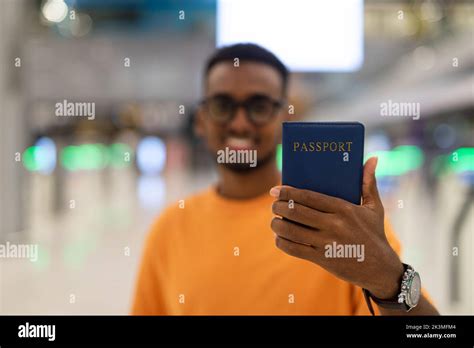 Young Handsome Black Man Ready To Travel At Airport Terminal Waiting