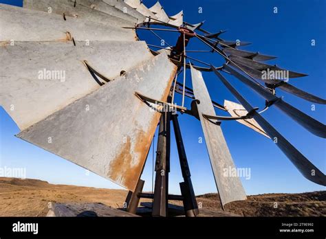 Windmill Pumping Water For Cattle On The Range In Nebraska National
