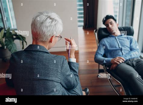 Consultation Of Young Male Patient On Reception For Psychologist Stock
