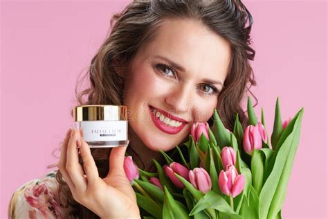 Portrait Of Smiling Modern Woman In Floral Dress On Pink Stock Image