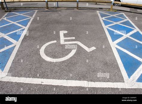 A Disabled Parking Bay With Wheelchair Sign And Parking Distance