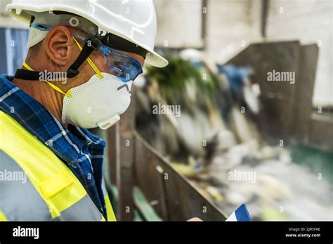Urban Waste Sorting Facility Technician Making Documentation Staying