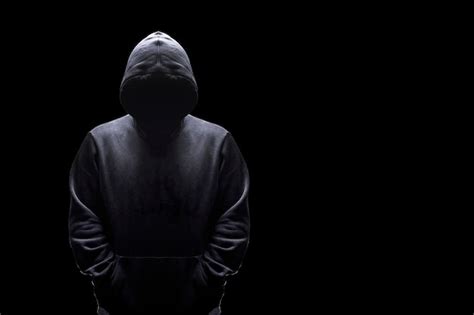 Premium Photo Silhouette Of A Man In A Hood With Wings From A Binary