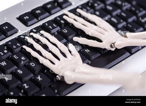 Skeleton working on the keyboard Stock Photo - Alamy