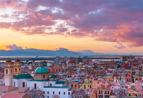 Sunset On Cagliari Evening Panorama Of The Old City Center In Sardinia