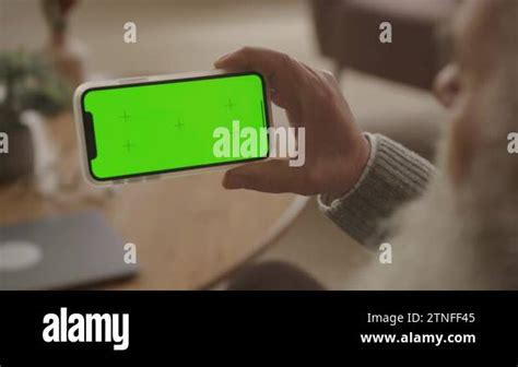 Grandfather Looking At Horizontal Chroma Key Smartphone Senior Man