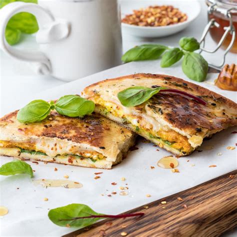 Egg And Melted Gouda Cheese Naan Bread Breakfast Sandwiches Stock
