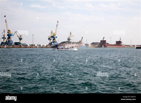 Cranes Loading Bulk Carrier Ship With Rock Ore At The Port Of Beni