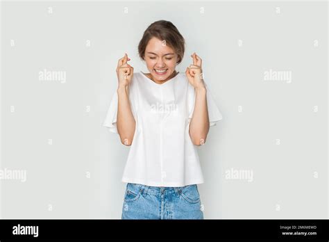 Young Pretty Woman Making A Wish Crossing Her Fingers Luck Closed