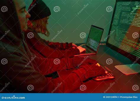 Anonymous People Using Computer And Programming To Break Code Cyber