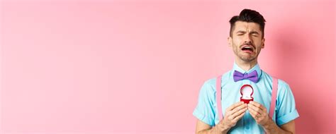 Free Photo Valentines Day Heartbroken Guy Crying And Holding