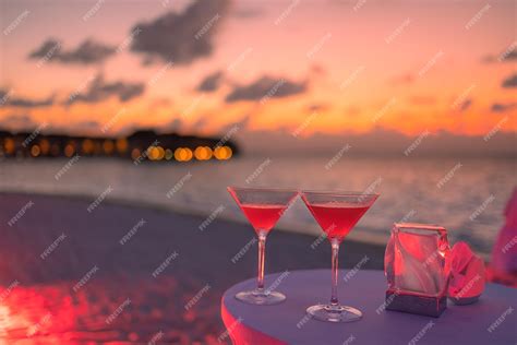 Premium Photo Two Cocktail Drinks With Blur Beach Party People And