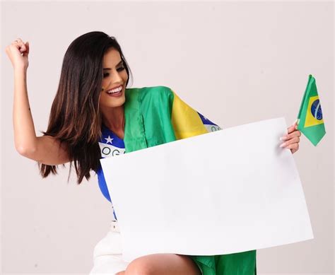 Premium Photo Cheerleader Holding Sign And Flag And Smiling
