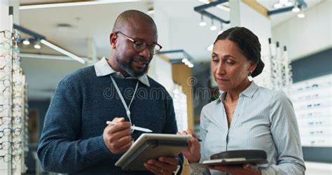 Optometrist Staff And Tablet For Optometry In Store With Teamwork