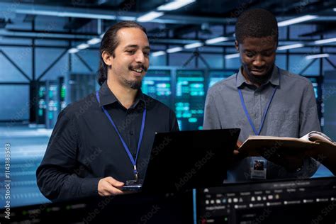 Cheerful It Specialists In Server Hub Ensuring Data Remains Shielded