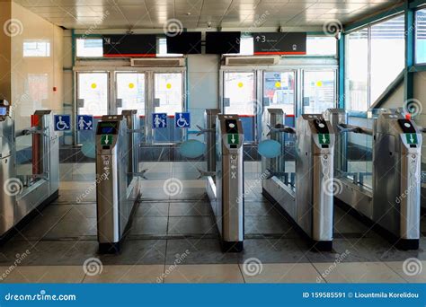 Metal Turnstiles With Glass Doors At The Entrance To The Subway Or