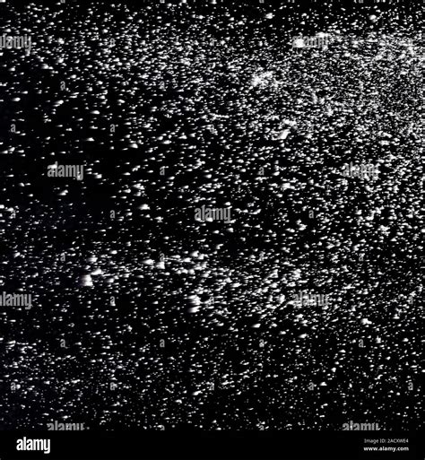 Particles Of Flour Distributed In Air To Demonstrate Brownian Motion