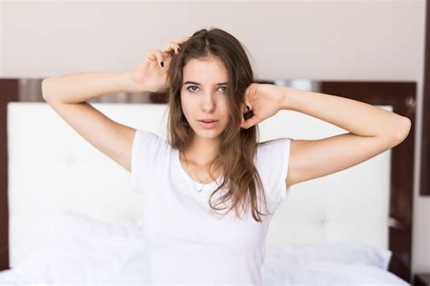 Free Photo Young Sexy Woman Stretching Arms In Her Bed After Wake Up