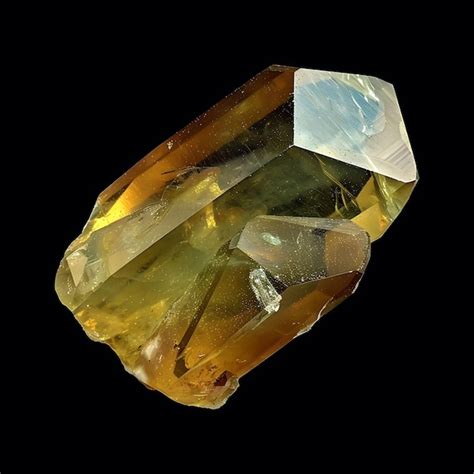 Premium Photo Zircon Crystal With Tetragonal Shape Yellow Brown Green