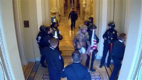 January 6 Footage Shows Capitol Cops Escorting Qanon Shaman To Senate