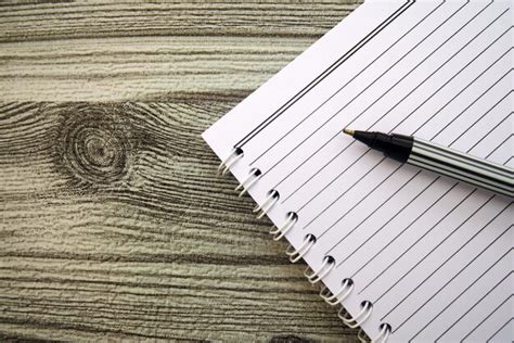 Premium Photo Notebook With Pen On Grey Wooden Table Background Top View With Copy Space