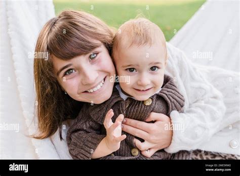 A Caucasian Teenage Girl With Brown Eyes Dark Hair And Bangs In A