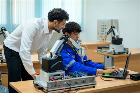 Premium Photo Trainee Robotics Engineer Learning With Programming And