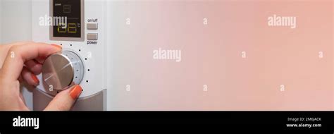 Gas Boiler A Woman Regulates The Temperature With A Temperature