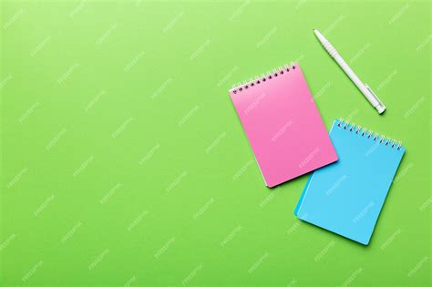 Premium Photo Two School Colored Notebook On A Desk Background Spiral