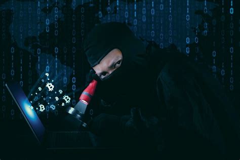 Premium Photo Hacker With Flashlight Trying To Hack In To A Customer Cryotocurrency Account