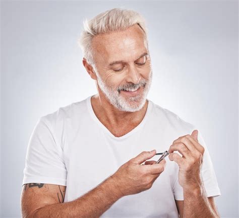 Premium Photo Nail Clippers Beauty And Grooming With A Man In Studio