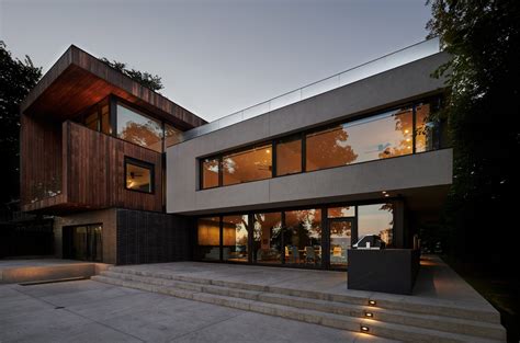 Dmac Creates Michigan Lake House With Cantilevered Ash Clad Volumes