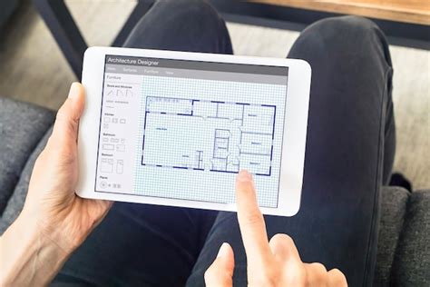 Premium Photo Person Sketching A Home Design Architecture Project On A Digital Tablet Computer