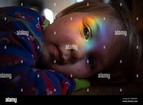 Rainbow Colors Reflect On Boy Face Stock Photo Alamy