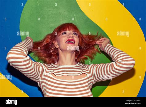 Happy Young Redhead Caucasian Woman In Retro Style Of 70s Posing At