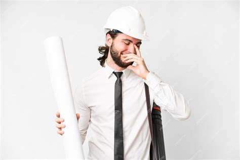 Premium Photo Young Architect Man With Helmet And Holding Blueprints Over Isolated White