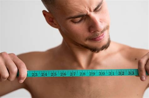 Free Photo Shirtless Man Holding Measuring Tape