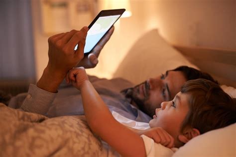 Premium Photo Modern Bedtime Story A Father Reading A Bedtime Story