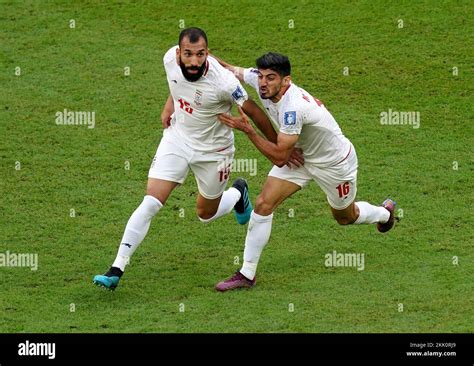 Irans Roozbeh Cheshmi Celebrates Scoring The Opening Goal With Team Mate Mehdi Torabi During
