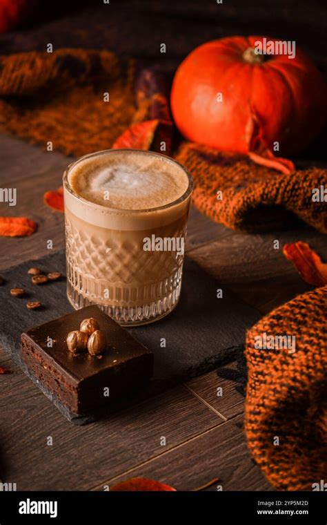 A Signature Latte Featuring Creamy Milk And Espresso Topped With A