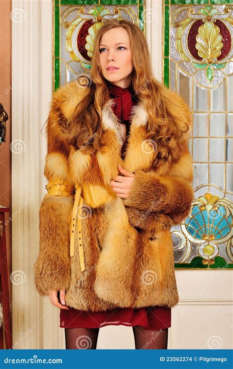 Beautiful Woman In Fur Coat In The Interior Stock Photo Image Of