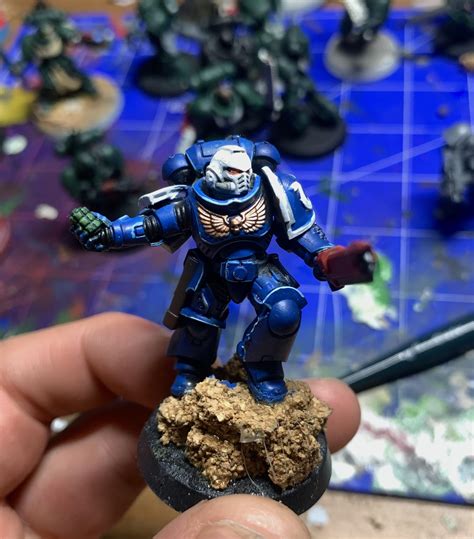 I’ve always found Macragge Blue a bit too dark as a base. So I went a ...