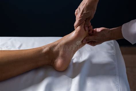 Massage Therapist Applying Massage On A Foot Stock Image Image Of