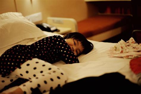 Premium Photo Smiling Girl Lying On Bed At Home