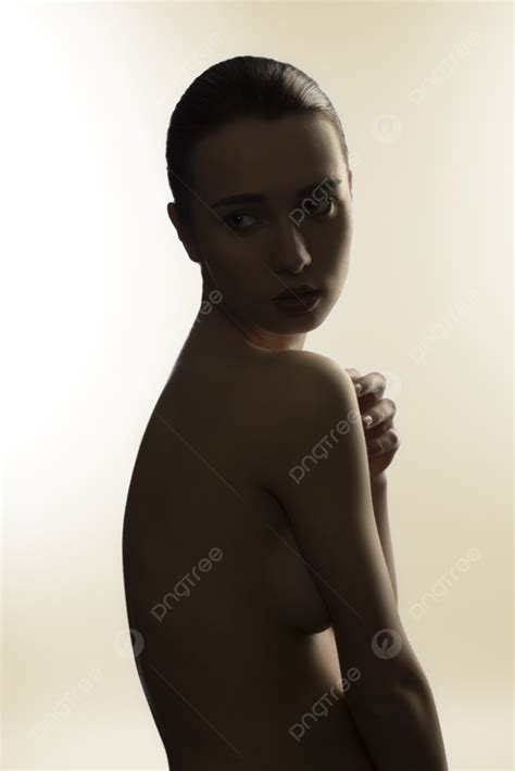 Cute Brunette Woman With Perfect Naked Body And Tied Back Hair Posing