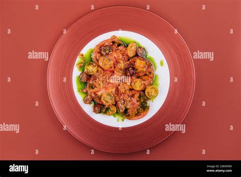 Gnocchi Fried With Cherry Tomatoes With Basil And Spinach Pesto Stock
