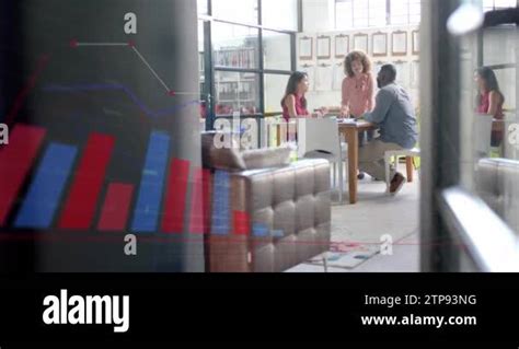 Graph And Data Processing Over Diverse Colleagues Discussing At Office