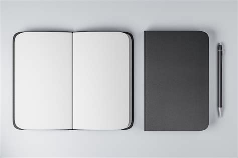 premium photo top view on notebooks with black cover and blank white