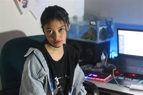Premium Photo Portrait Of Girl Sitting By Computer