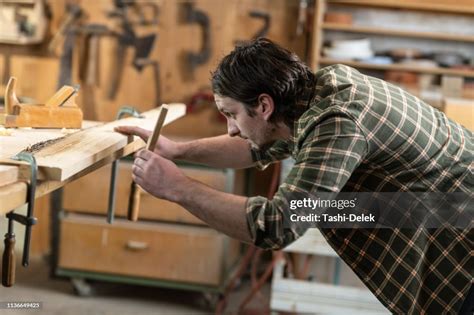 Carpenter Making Measurements On A Wood Plank High-Res Stock Photo ...